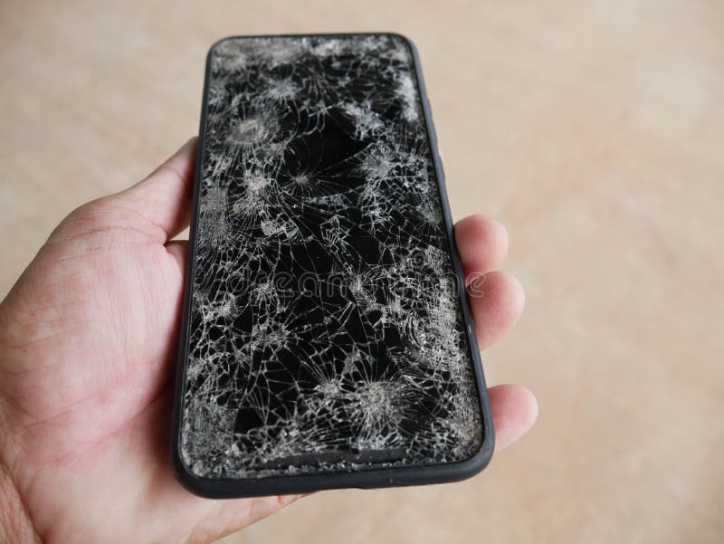 The Smartphone Hit the Floor, it Fell into a Crack Stock Photo - Image ...