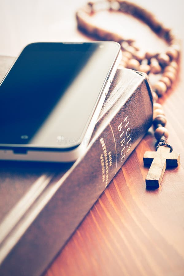 Smartphone with Holy Bible and Rosary Stock Image - Image of cellphone ...