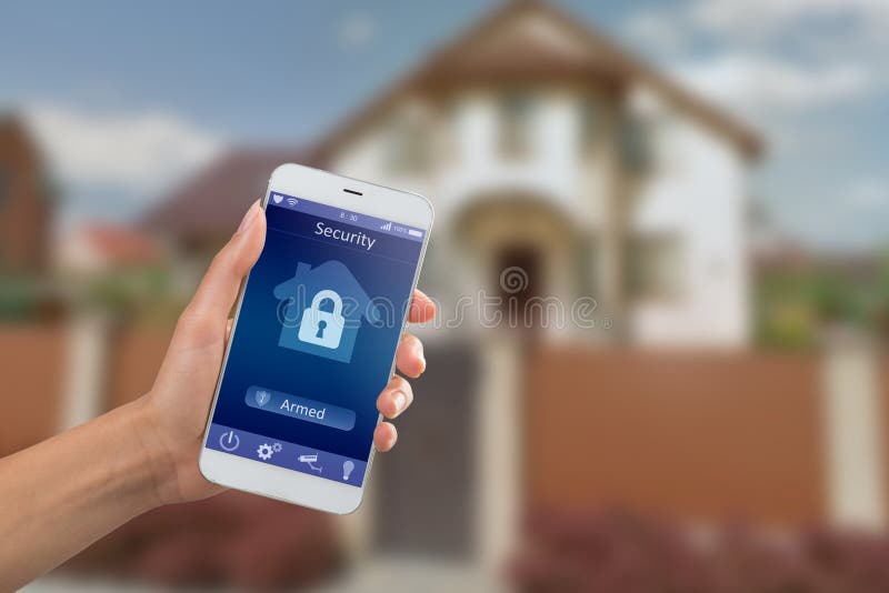 Smartphone with Home Security App in a Hand on the Building Background ...