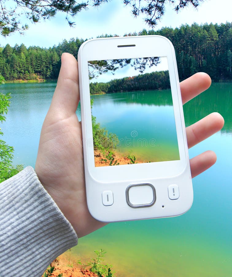 Smartphone with Image of Forest Lake on Screen in Human Hand Stock ...