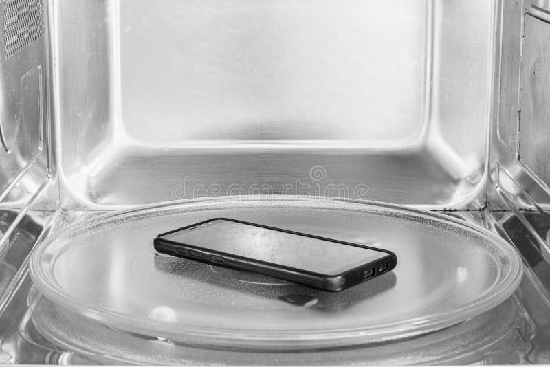 Smartphone Inside the Microwave Stock Photo - Image of damage, warming ...