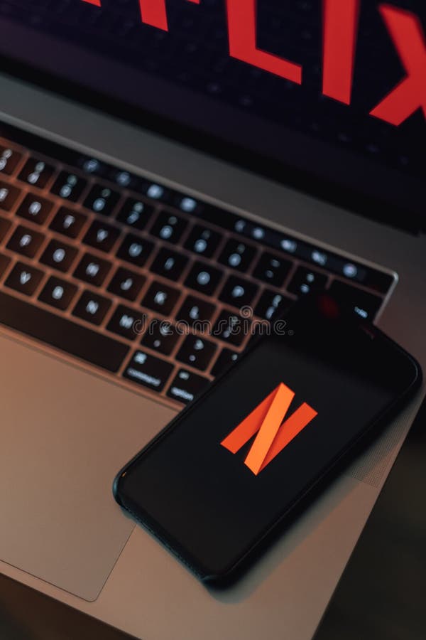 Smartphone and Laptop with Screen of Netflix Logo. Editorial Stock ...