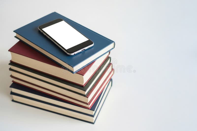 The Smartphone is Lying on a Stack of Colorful Books. Space for Text ...