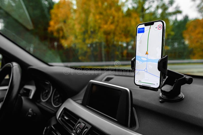 Smartphone with Navigation Route on Screen Mounted on Phone Holder at ...