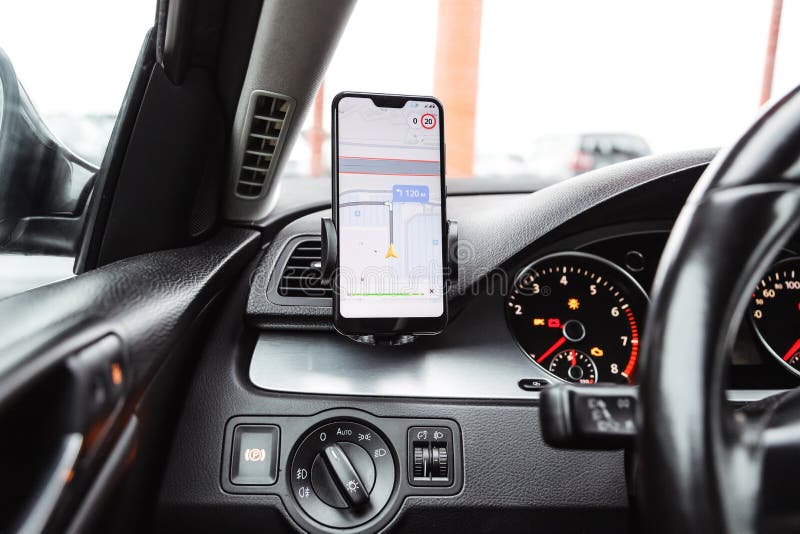 Smartphone with Navigation Route on Screen Mounted on Phone Holder at ...