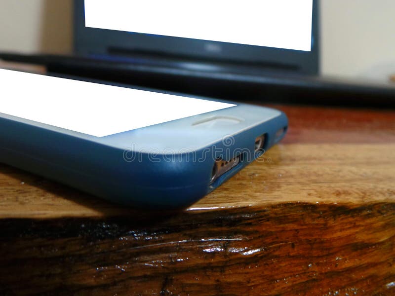 Smartphone and Notebook on the Desk. this Technology is Currently in ...