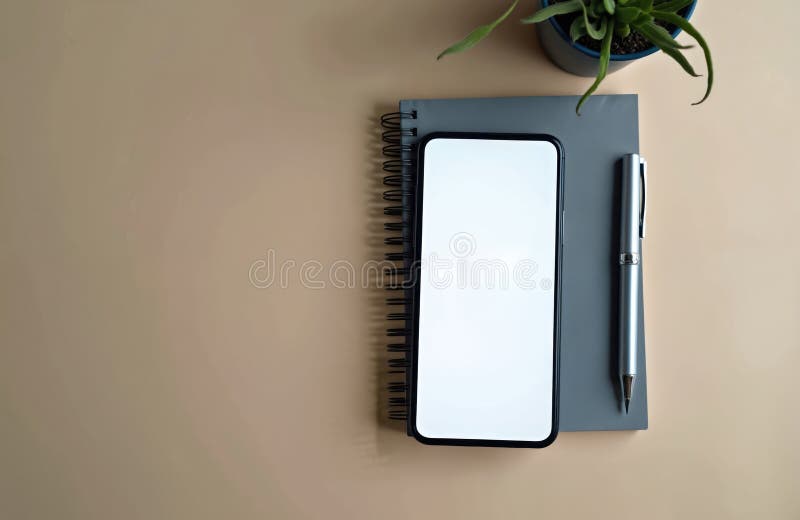 Smartphone, Notebook, Pen, Plant on Beige Desk. Workspace Tech Concept ...