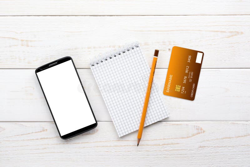 Smartphone, Notebook, Pencil and Credit Card on a White Table Stock ...