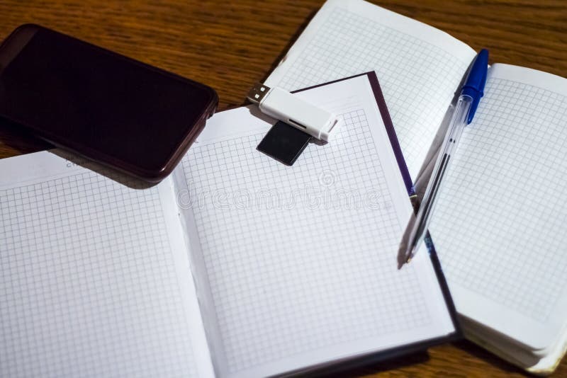 Smartphone on the Open Diary with a Ballpoint Pen and a USB Flash Drive ...