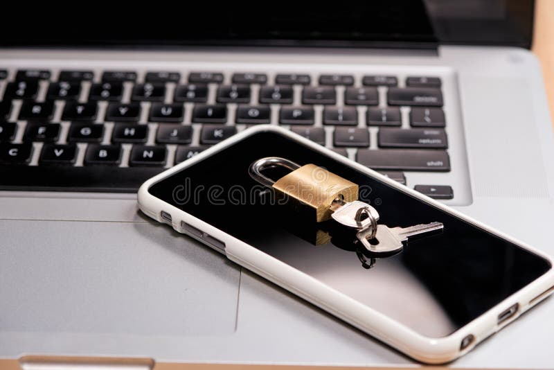 Smartphone and Padlock is Lying on a Laptop Keyboard Stock Image ...
