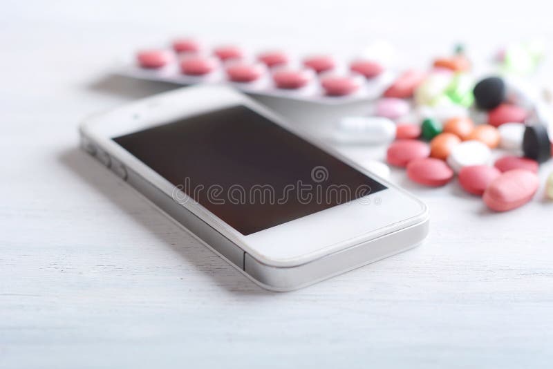 Smartphone with pills. stock photo. Image of healthy - 97914530