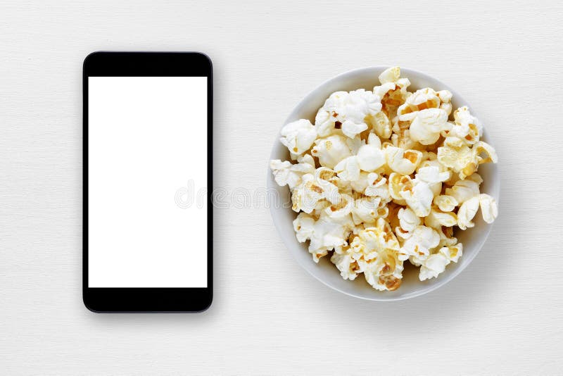 Smartphone and Popcorn in Bowl on Table Stock Photo - Image of ...