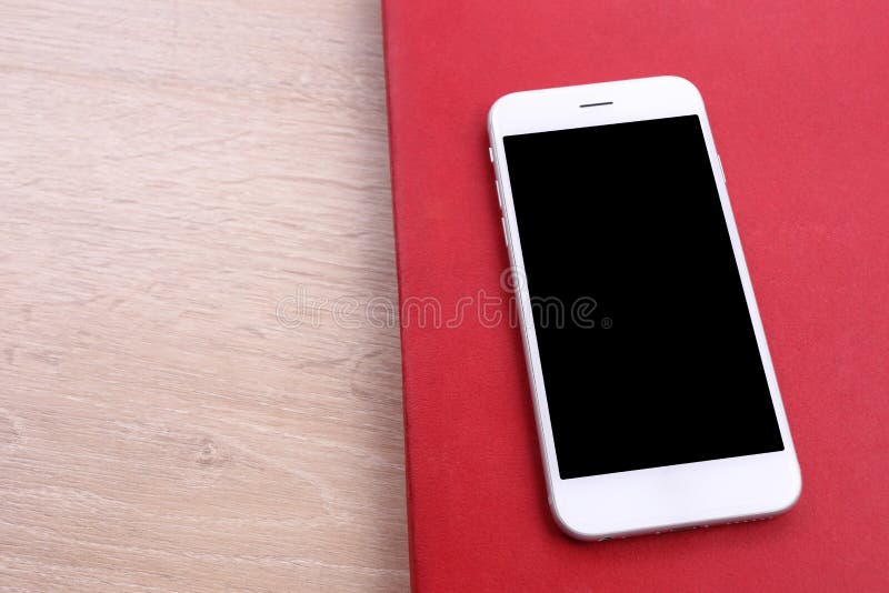 Smartphone on Red Book and Glasses on Wooden Background Stock Image ...