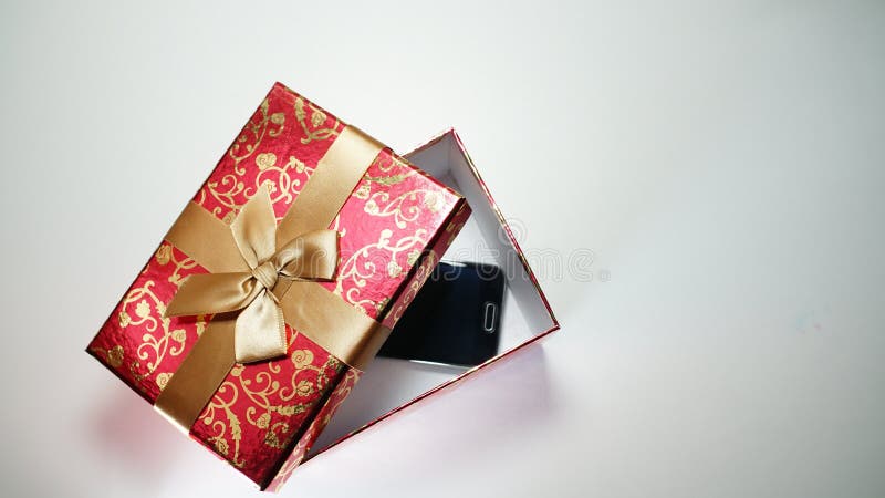 Smartphone in Red Gift Box on White Background Stock Image - Image of ...
