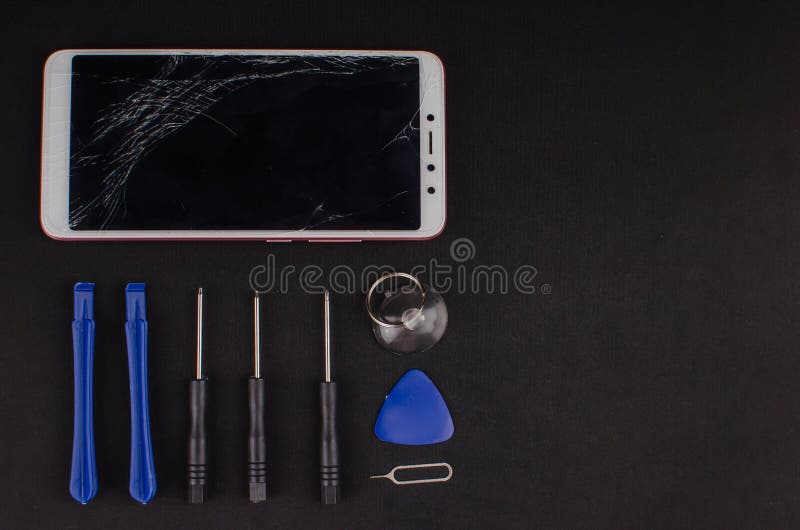 Smartphone Repair on Black Background. Replacement of a Broken Screen ...