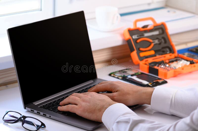 . Smartphone Repair Courses. There is a Computer and a Disassembled ...