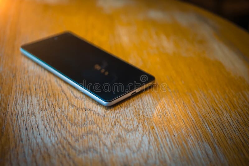 A Smartphone Rests on a Table Stock Image - Image of rest, mobile ...
