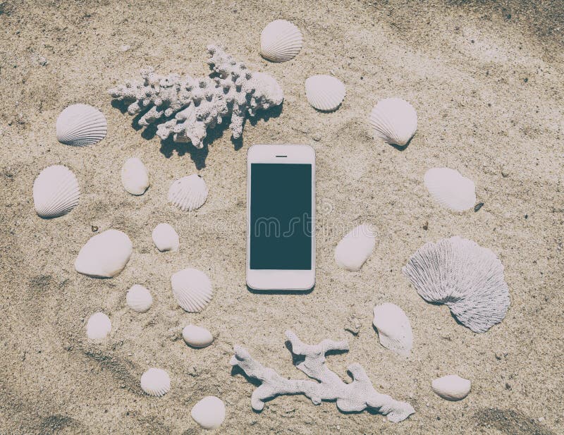 Smartphone in the Sand with Shells and Corals, Business and Tech Stock ...