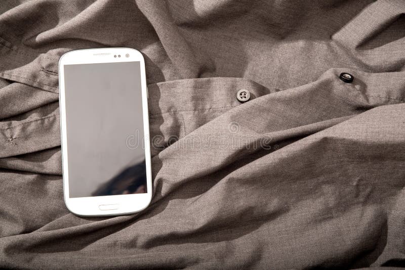 Smartphone on a shirt stock image. Image of screen, elegant - 40344489