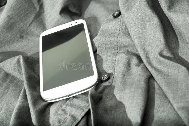 Smartphone on a shirt stock image. Image of computer - 40344495