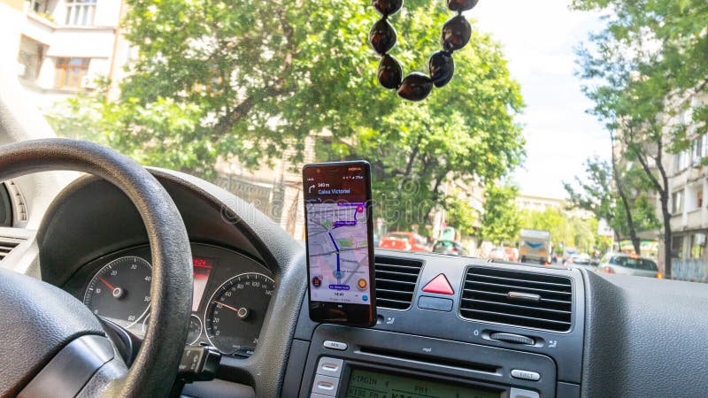 Smartphone Showing Waze Maps To Show the Way Thru the City Editorial ...