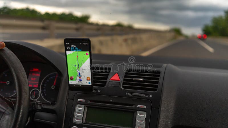 Smartphone Showing Waze Maps To Show the Way Thru the City Editorial ...