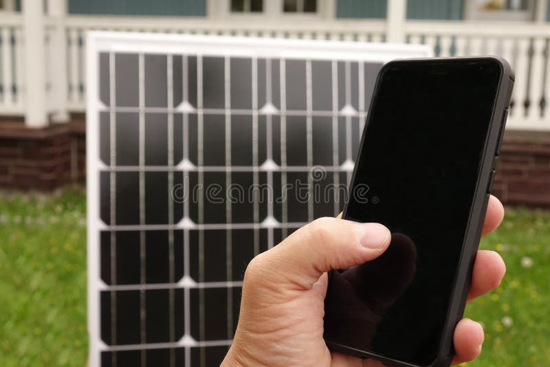 Smartphone and Solar Panel. Energy Production Technologies. Saving on ...