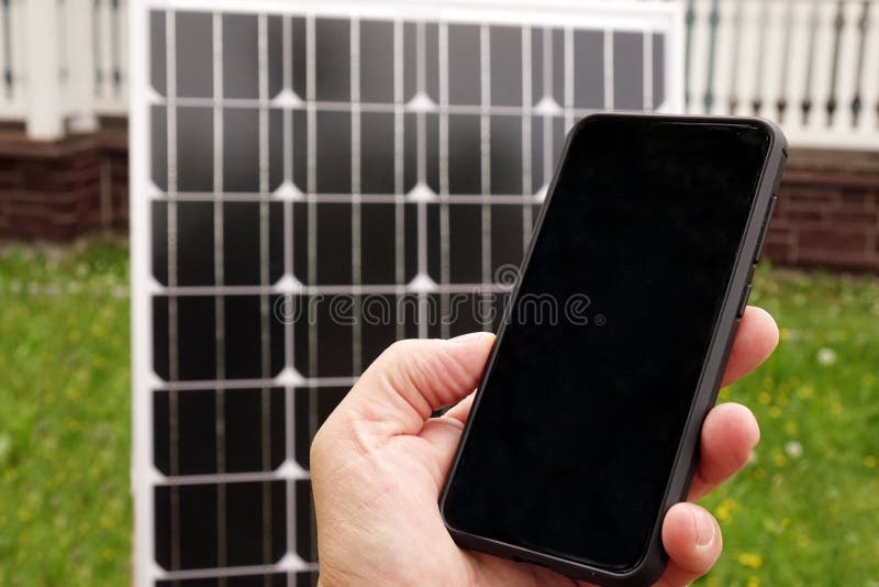 Smartphone and Solar Panel. Energy Production Technologies. Saving on ...
