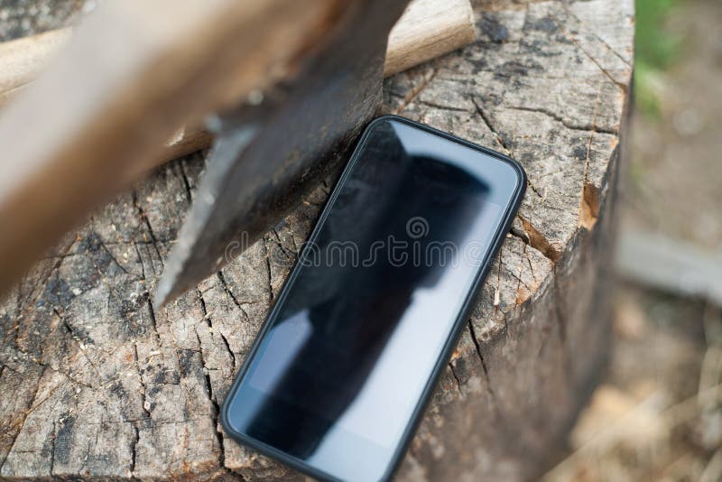 Smartphone on the Stump. Smartphone Near the Ax Stock Image - Image of ...