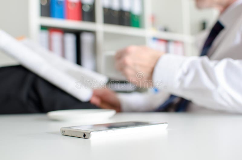 Smartphone on a Table during Break Stock Photo - Image of reading ...