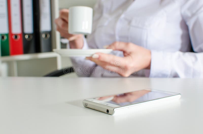 Smartphone on a Table during Break Stock Photo - Image of white, person ...