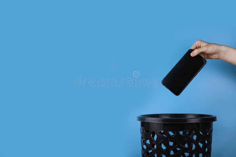 The Smartphone is Thrown into the Trash for Disposal Stock Image ...