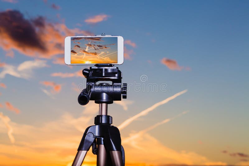 Smartphone on Tripod Capturing Image of Stunning Sundown Stock Photo ...