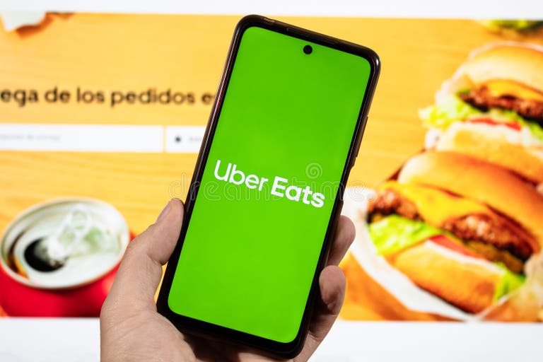 A Smartphone with Uber Eats Logo and Blurred Uber Eats Interface at Background Editorial Stock ...