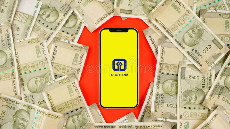 Smartphone with the UCO Bank Logo on the Screen and Indian Banknotes on ...