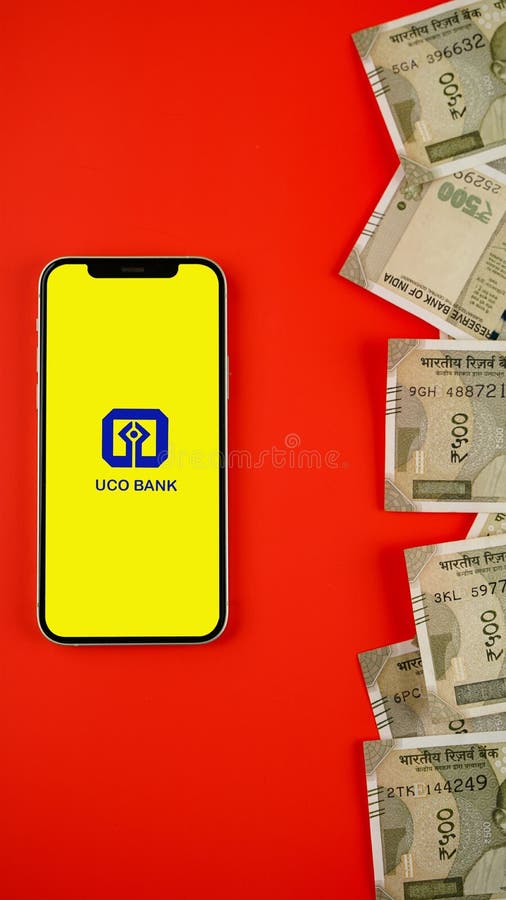 Smartphone with the UCO Bank Logo on the Screen and Indian Banknotes on ...