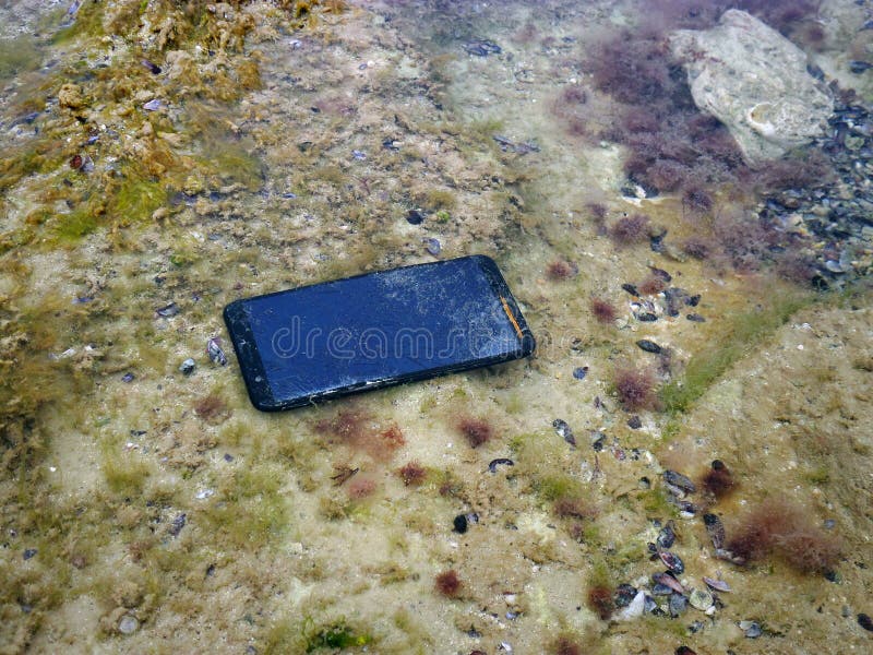 Smartphone under water stock photo. Image of beach, cellphone - 230260240