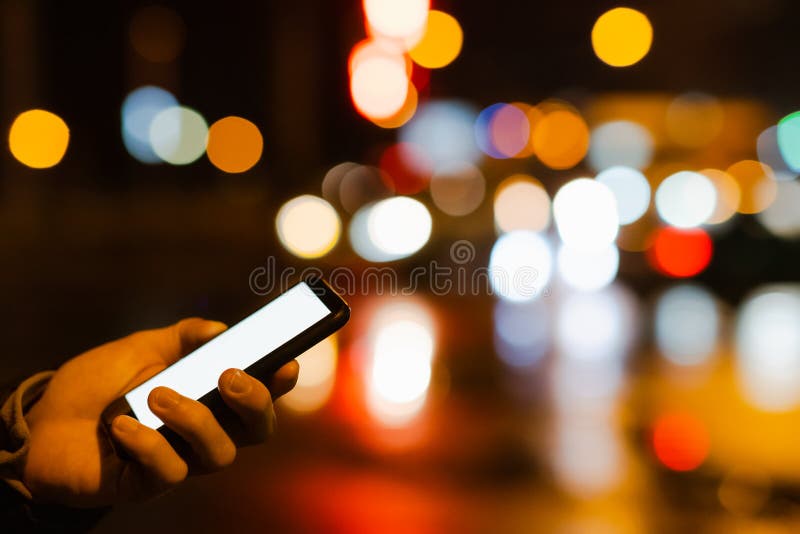 Smartphone with White Screen in Human Hand, Copy Space in Darkness with ...