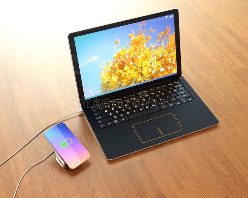 Smartphone on a Wireless Charging Pad. the Pad Connected To a Laptop ...