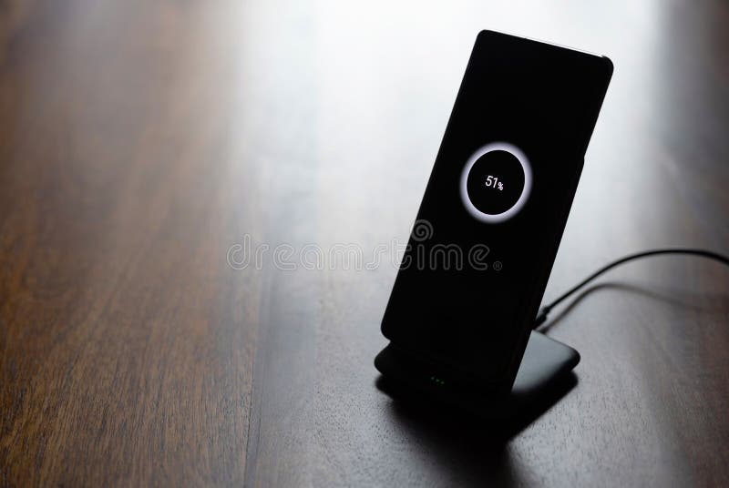 Smartphone Wireless Charging on Charging Stand with 51 Percent Icon on ...