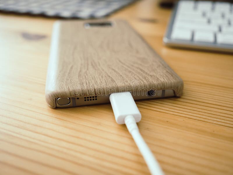 Smartphone on wooden desk. stock image. Image of copy - 83548335