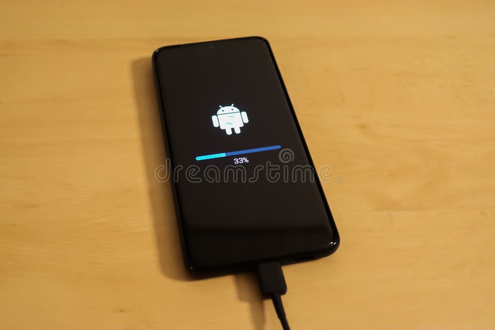 Smartphone on a Wooden Surface with the Progress Indicator of an ...