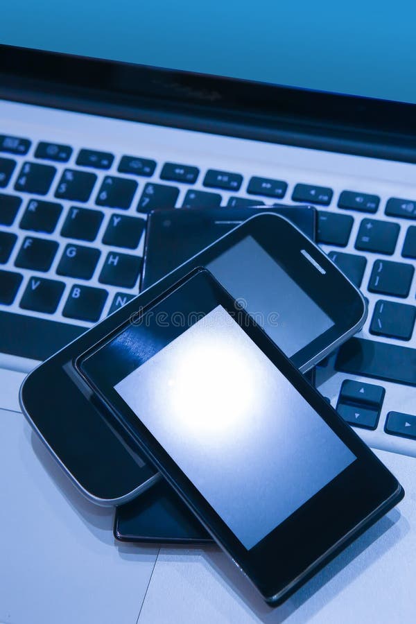 Smartphones on Computer Keyboard Stock Image - Image of macro, closeup ...