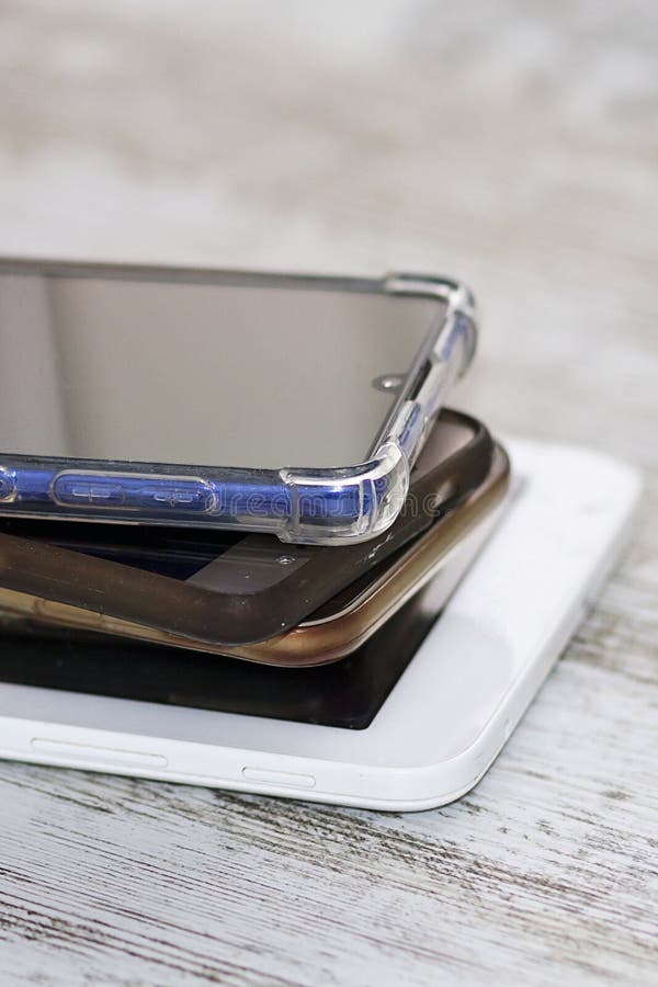 Smartphones pile and cable stock image. Image of phone - 252565989