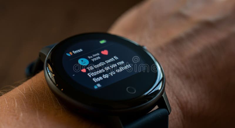 A Smartwatch with a Round, Black Face Displays a Digital Interface. the ...