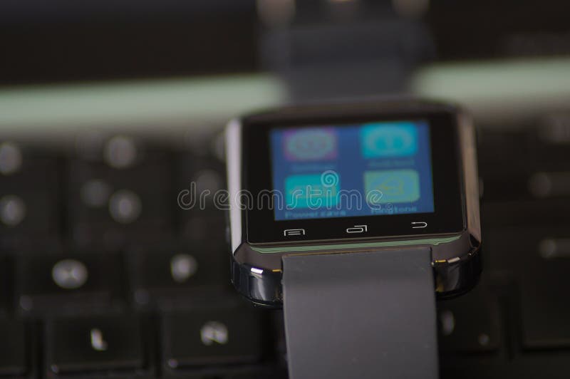 Smartwatch with Screen Lit Up Sitting on Top of Computer Keyboard, Very ...