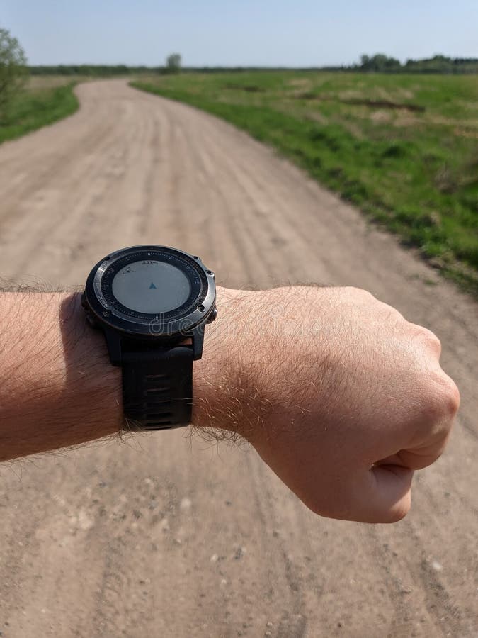 Smartwatch Show the Direction of the Route on the Field Road. Trekking ...