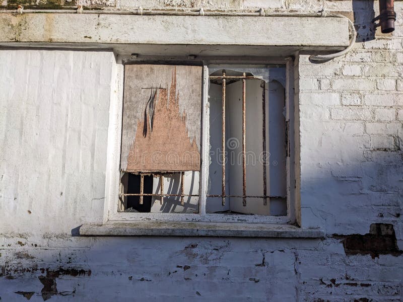 Smashed Broken Window with Chipped Wall Down an AlleyWay Abandoned ...