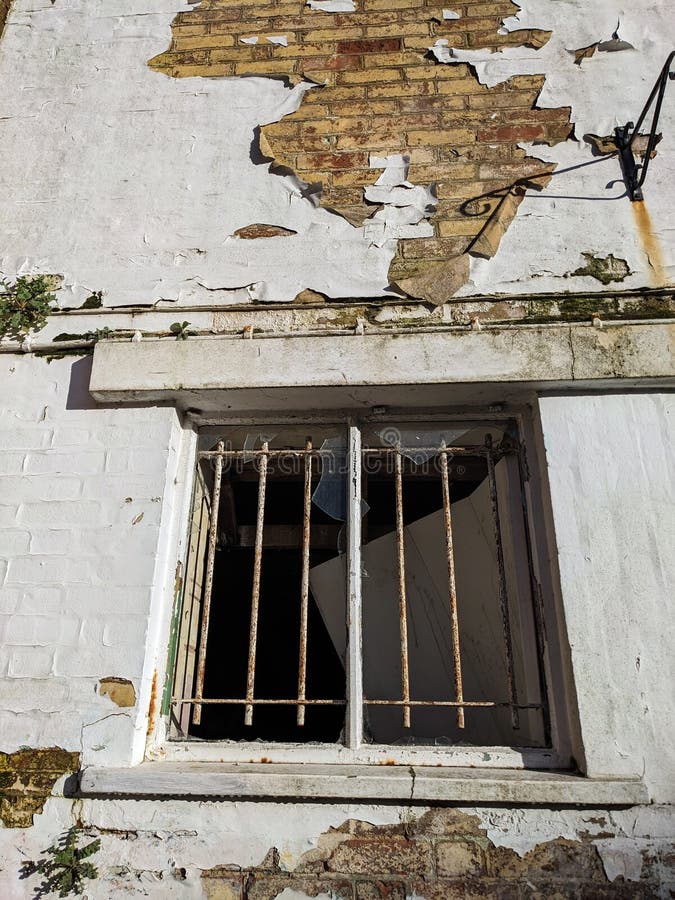 Smashed Broken Window with Chipped Wall Down an AlleyWay Abandoned ...