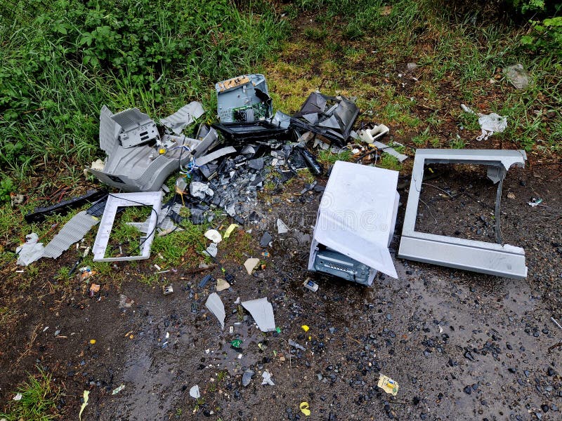 Smashed Computers in a Roadside Ditch. Hazardous Waste Belonging Stock ...